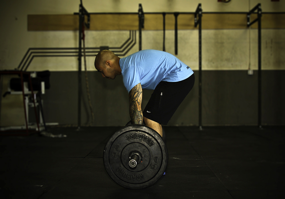 Having Lower Back Pain From Deadlifts? Here's How To Fix It